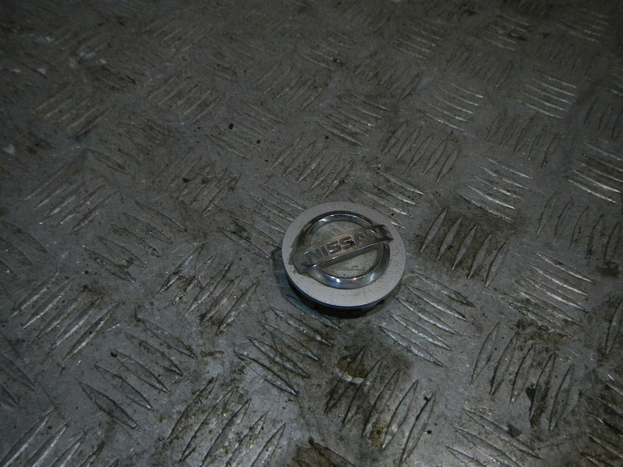 Б/У Колпак декоративный легкосплавного диска, Nissan (Ниссан)-TIIDA (C11) (07-) NISSAN TIIDA (C11) (07-) Царапины. Слома...