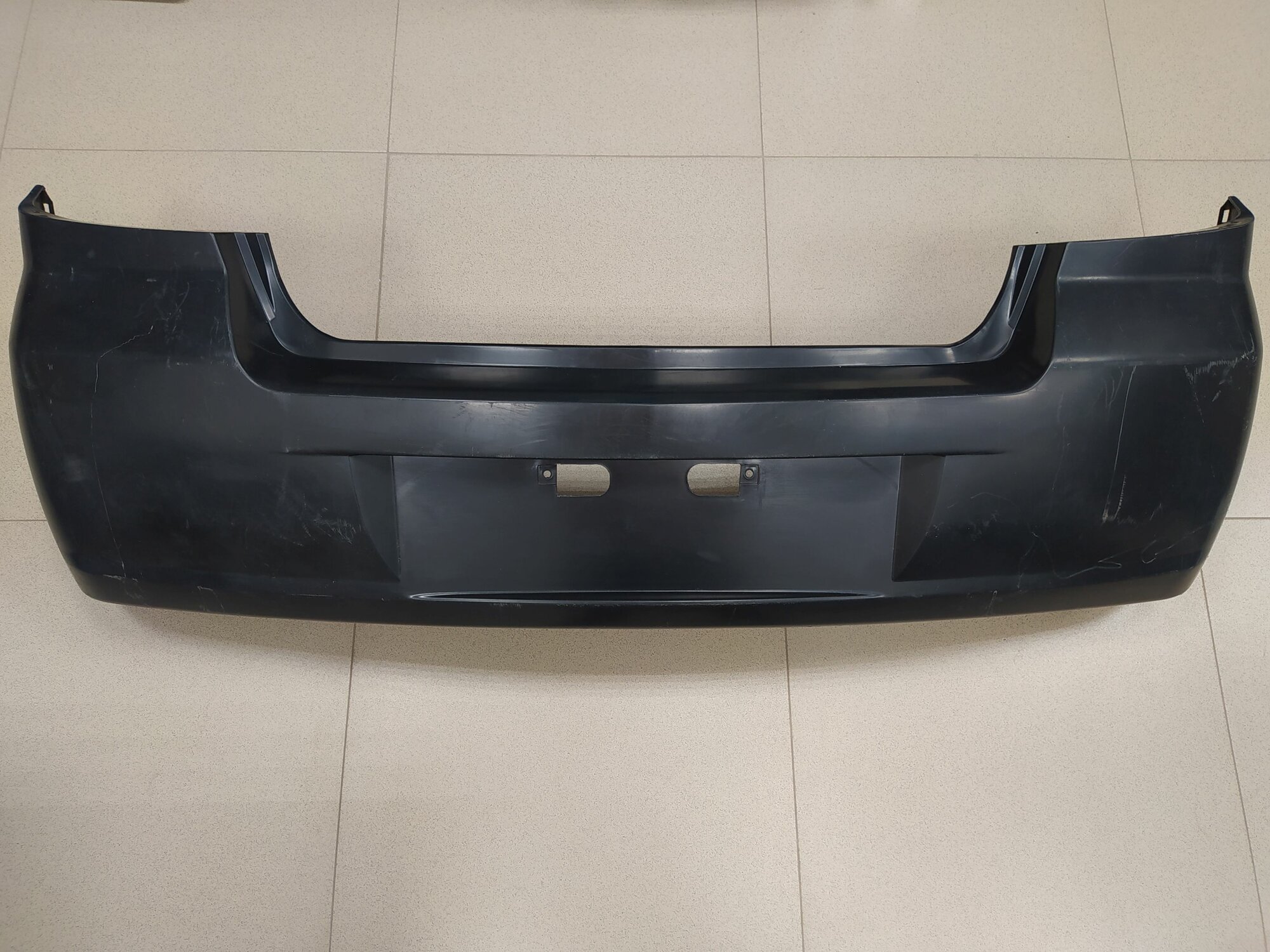 Бампер задний Geely MK Cross [1.5 16V 5MT хетчбэк] 1018006132