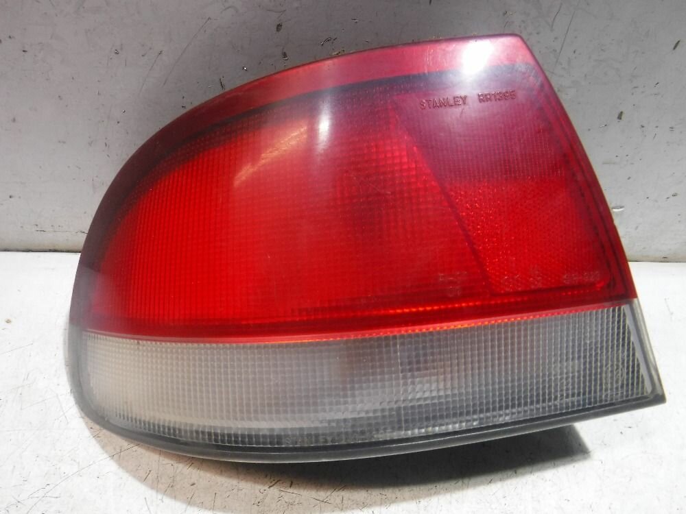 Фонарь задний левый Mazda 626 GE