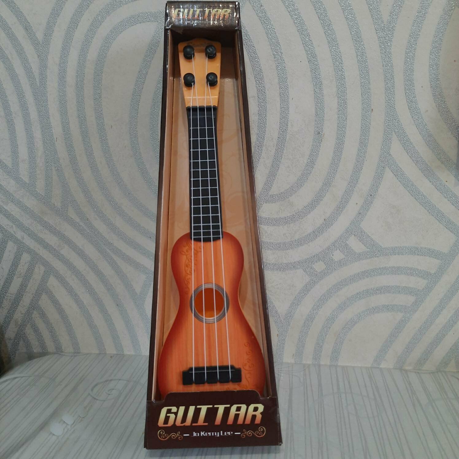 Игрушка музыкальная Гитара , 4 струны, для детей от 3-ех лет.