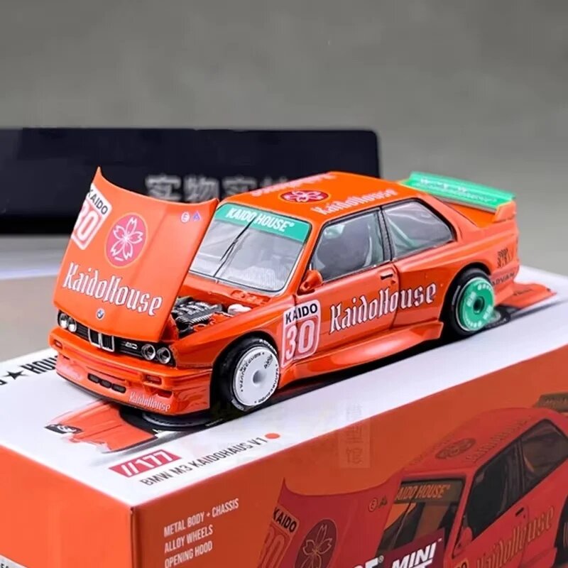 MINI GT X Kaido House BMW M3 E30 V1 1:64 оранжевый