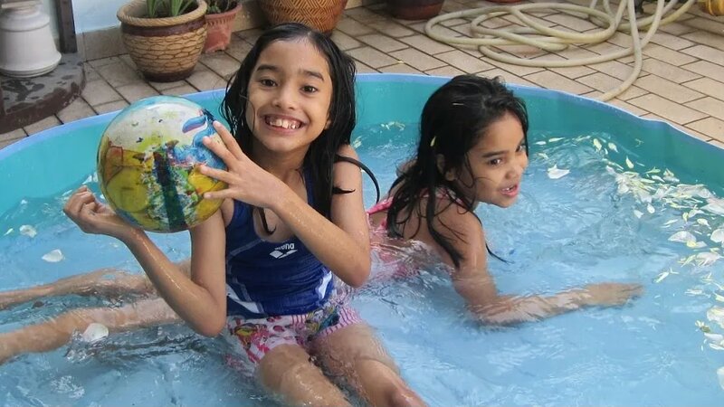 Kiddy pool / Kids swimming in outdoor kiddie pool / Plastic kiddie pool