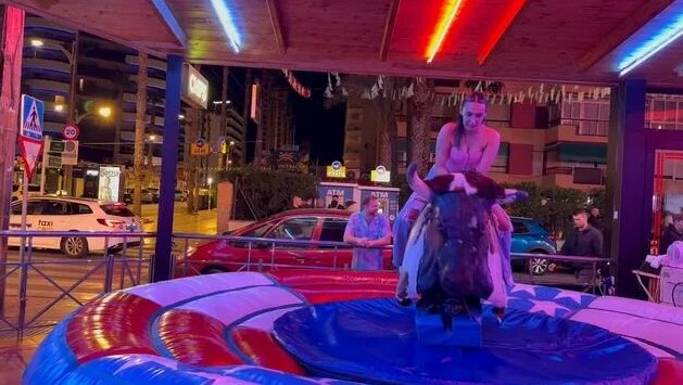 Girl in a pink T-shirt Riding on a Bull in Benidorm | Bull Riding 4K ...